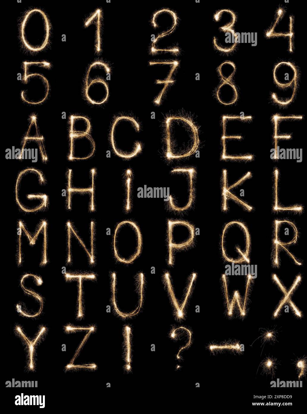 English Letters from sparklers, alphabet and numbers on black ...