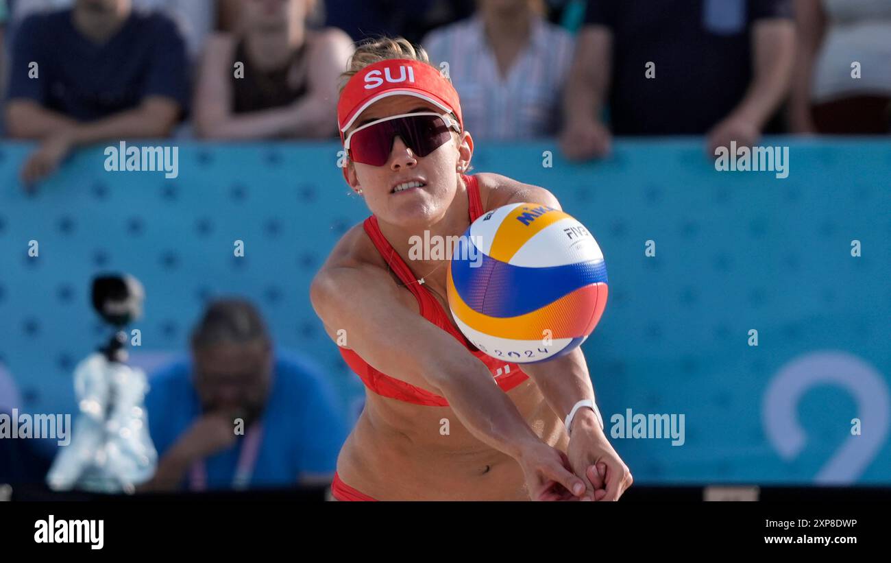 Switzerland's Tanja Hueberli returns a shot in a beach volleyball match ...