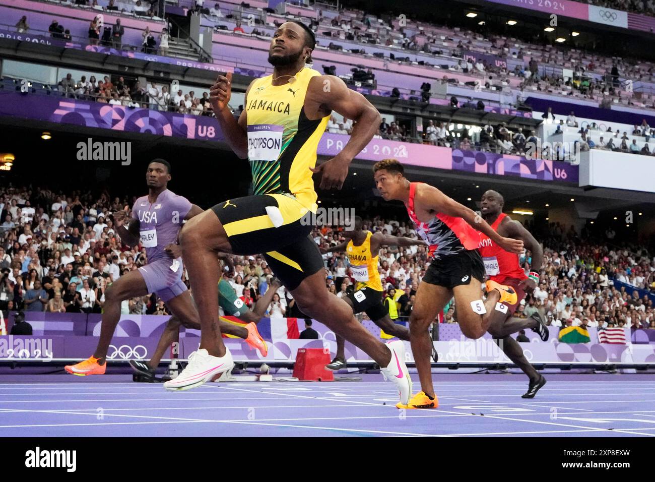 Kishane Thompson, of Jamaica, wins a heat in the men's 100-meter ...