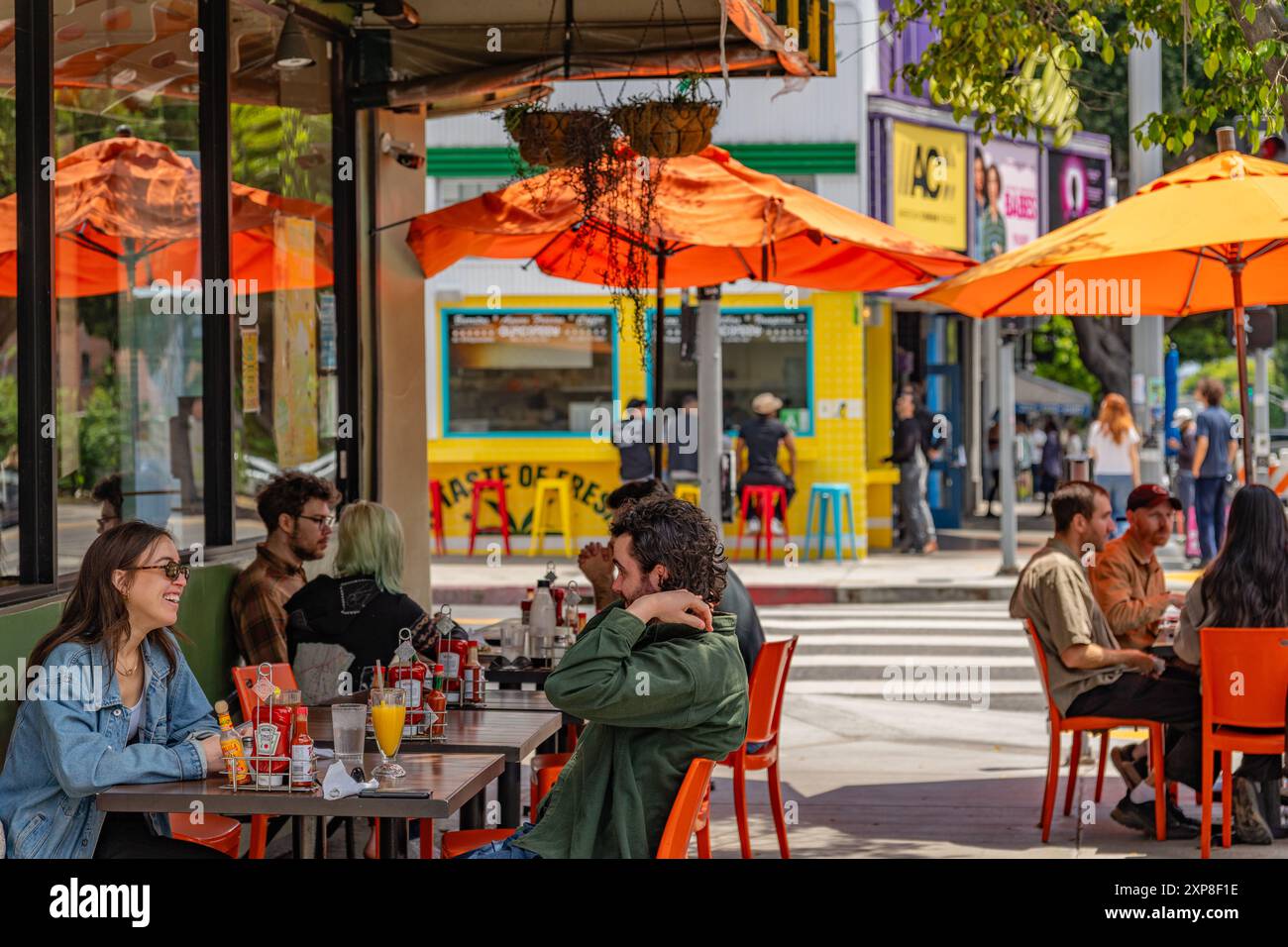Los Angeles, CA, US-May 25, 2024: People eating at outdoor restaurant ...