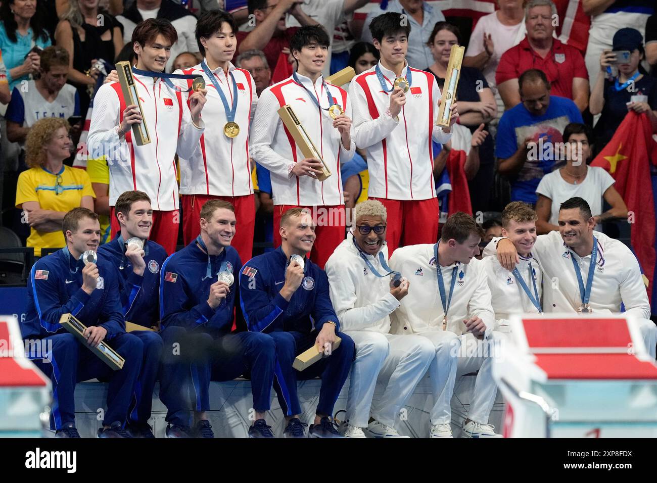 China's gold medalists pose for a photo with United States' silver ...