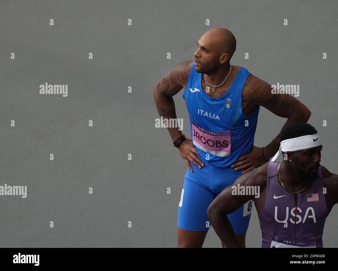 Paris, France. 4th Aug, 2024. Lamont Marcell Jacobs (L) of Italy reacts ...