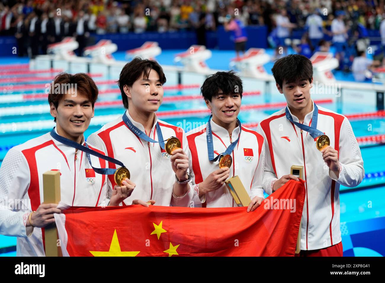 China's Xu Jiayu, Qin Haiyang, Sun Jiajun, and Pan Zhanle pose for a photo with their gold ...
