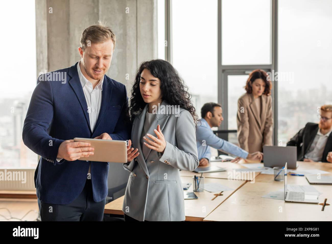 Reviewing documents diverse team digital hi-res stock photography and ...