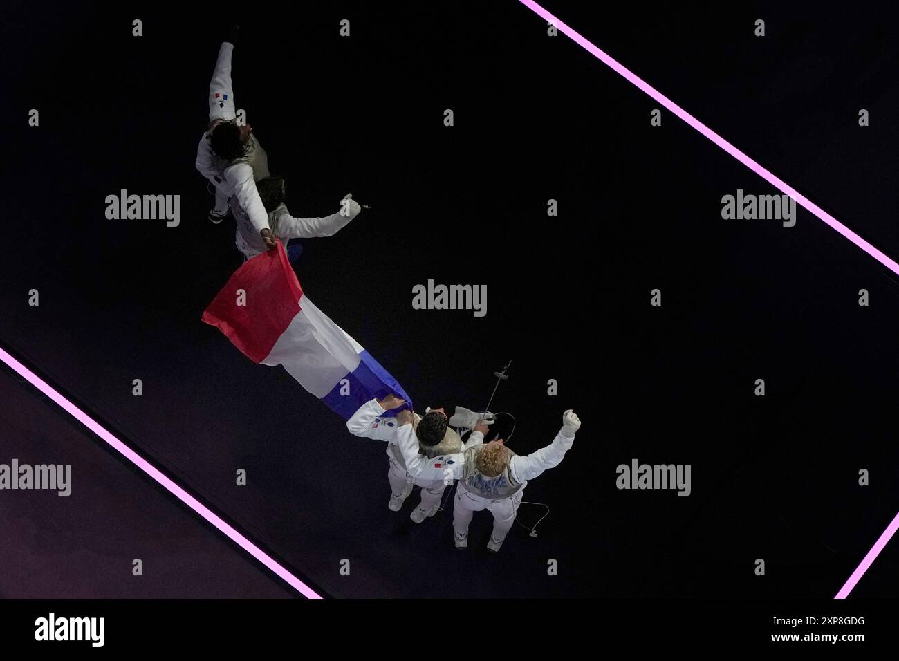 French fencers celebrate after defeating the United States in the men's ...