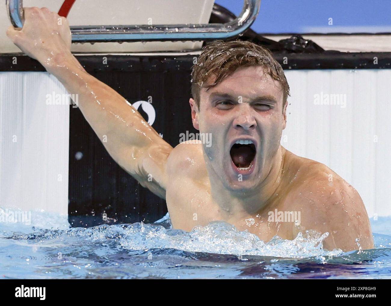 Bobby Finke of the United States reacts after winning the men's 1500 ...
