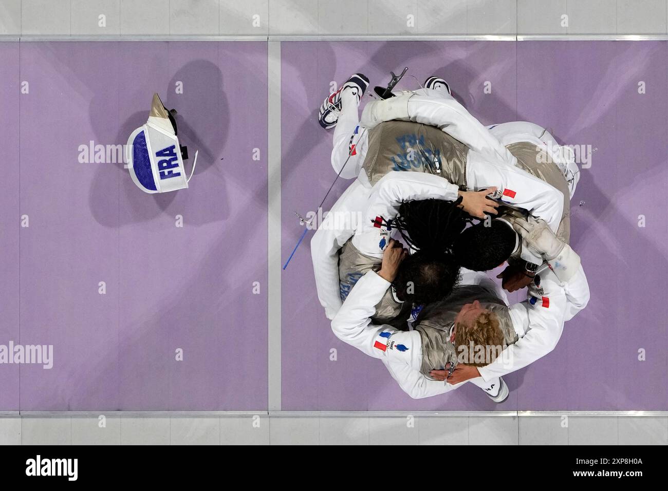 French fencers celebrate after defeating the United States in the men's ...