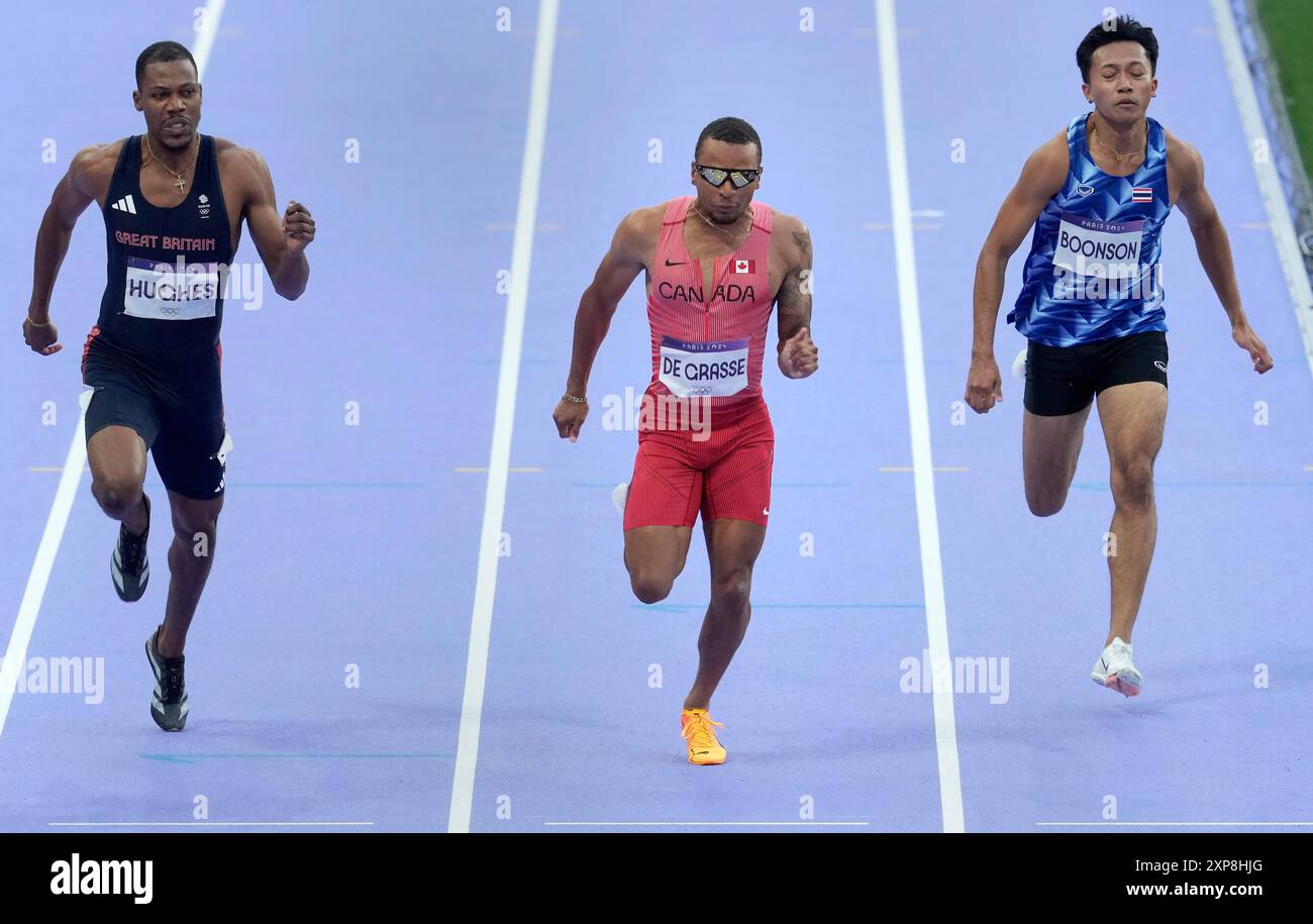 Canada's Andre De Grasse, centre, surges for the finish line against ...