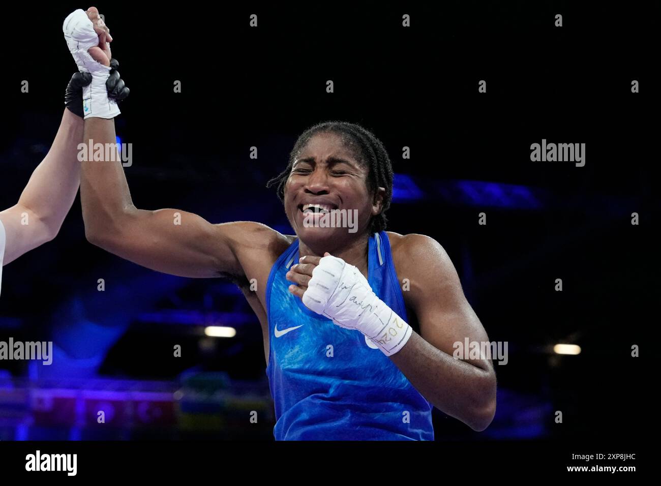 Refugee Olympic Team's Cindy Ngamba celebrates after defeating Canada's ...