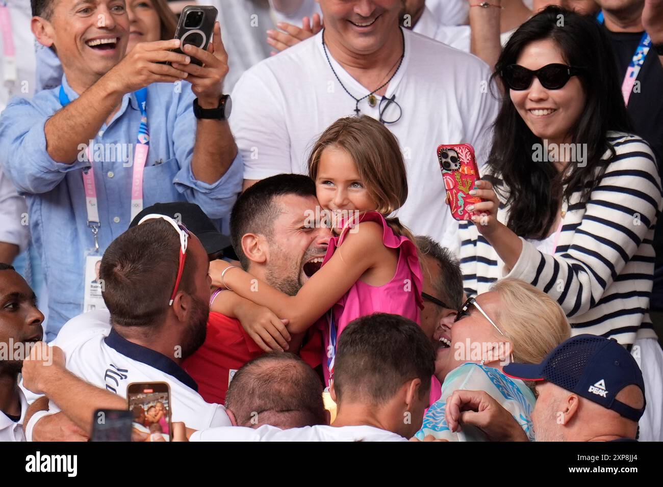 Serbia's Novak Djokovic embraces his daughter Tara after defeating ...