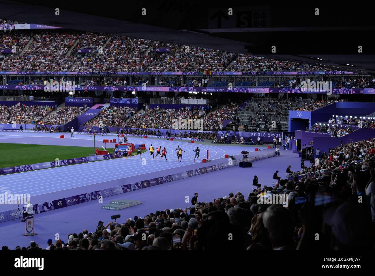 Competitors cross the finish line in their men's 100-meter semifinal at ...