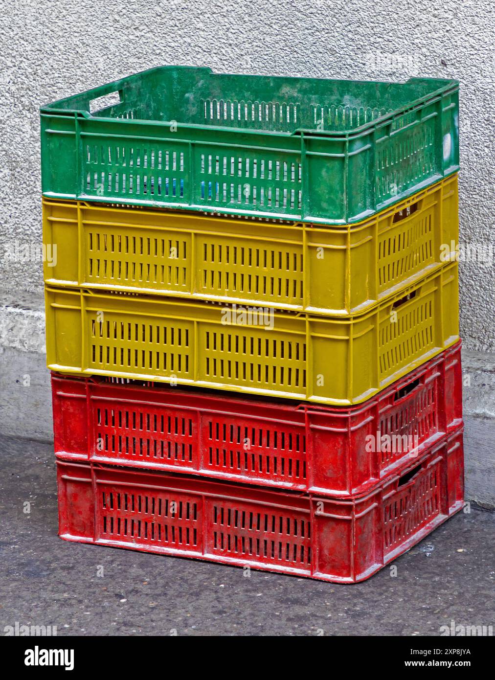 Colorful empty plastic trays stack outside on market place Stock Photo ...
