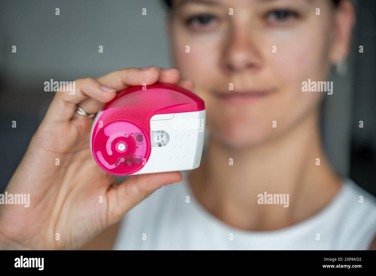 Close up view of woman holding medicine dry powder inhaler for ...