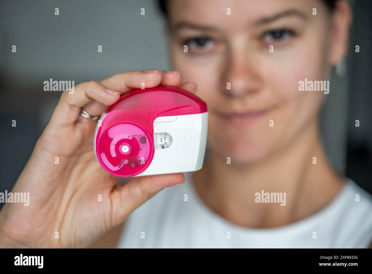 Close up view of woman holding medicine dry powder inhaler for ...