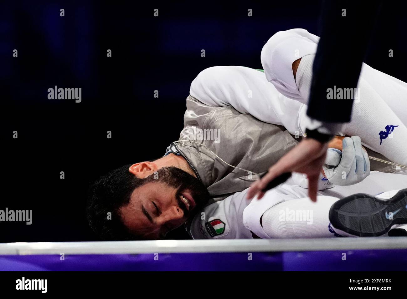 Italy's Guillaume Bianchi reacts as he competes with Japan's Kyosuke ...