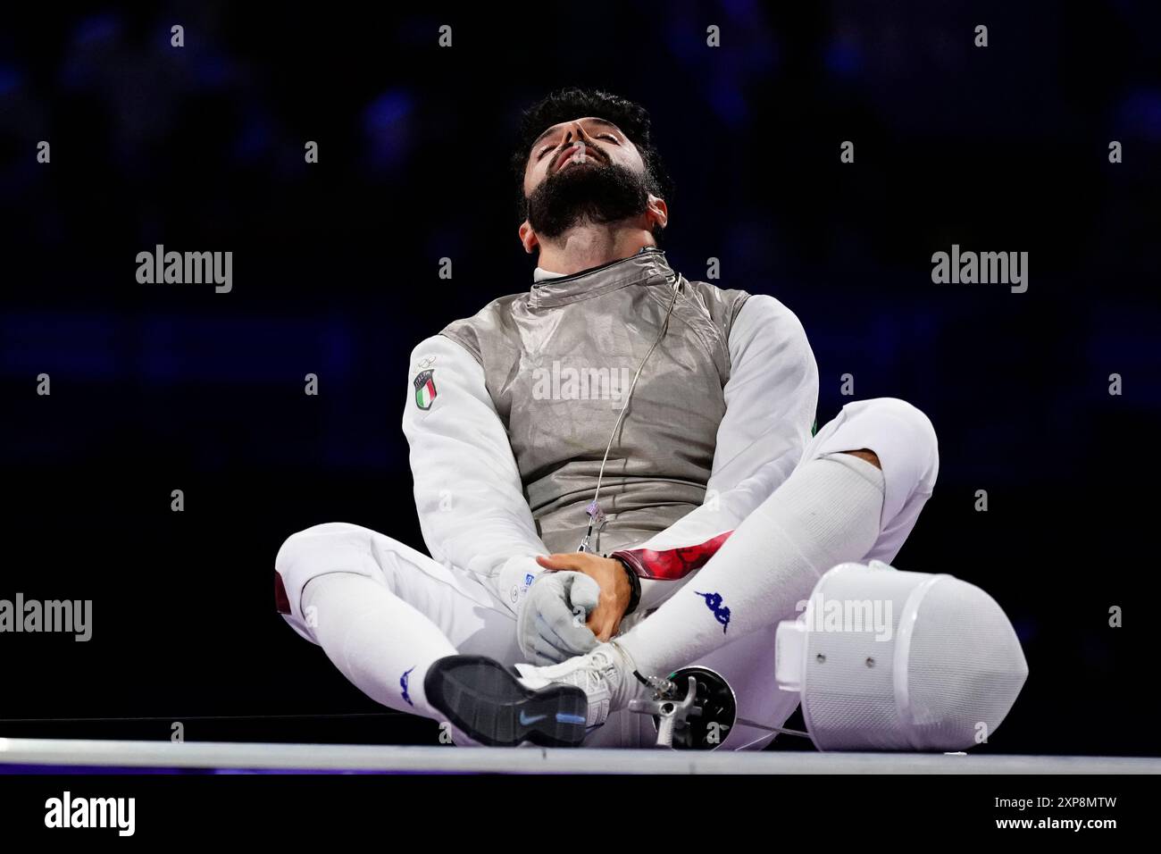 Italy's Guillaume Bianchi reacts as he competes with Japan's Kyosuke ...