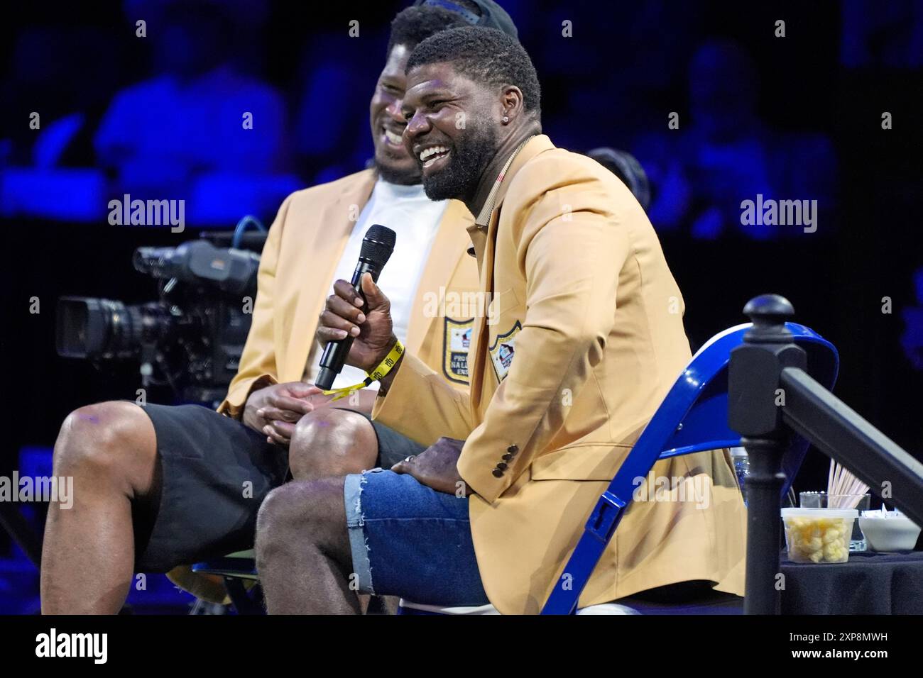 Pro Football Hall of Fame Class of 2024 members Devin Hester, right, and Andre Johnson ...