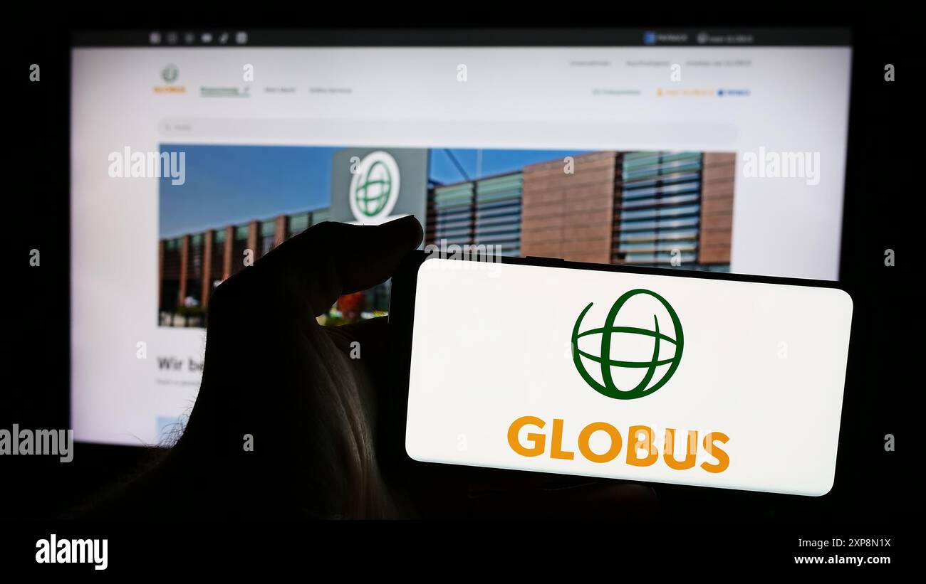 Globus hypermarket holding hi-res stock photography and images - Alamy