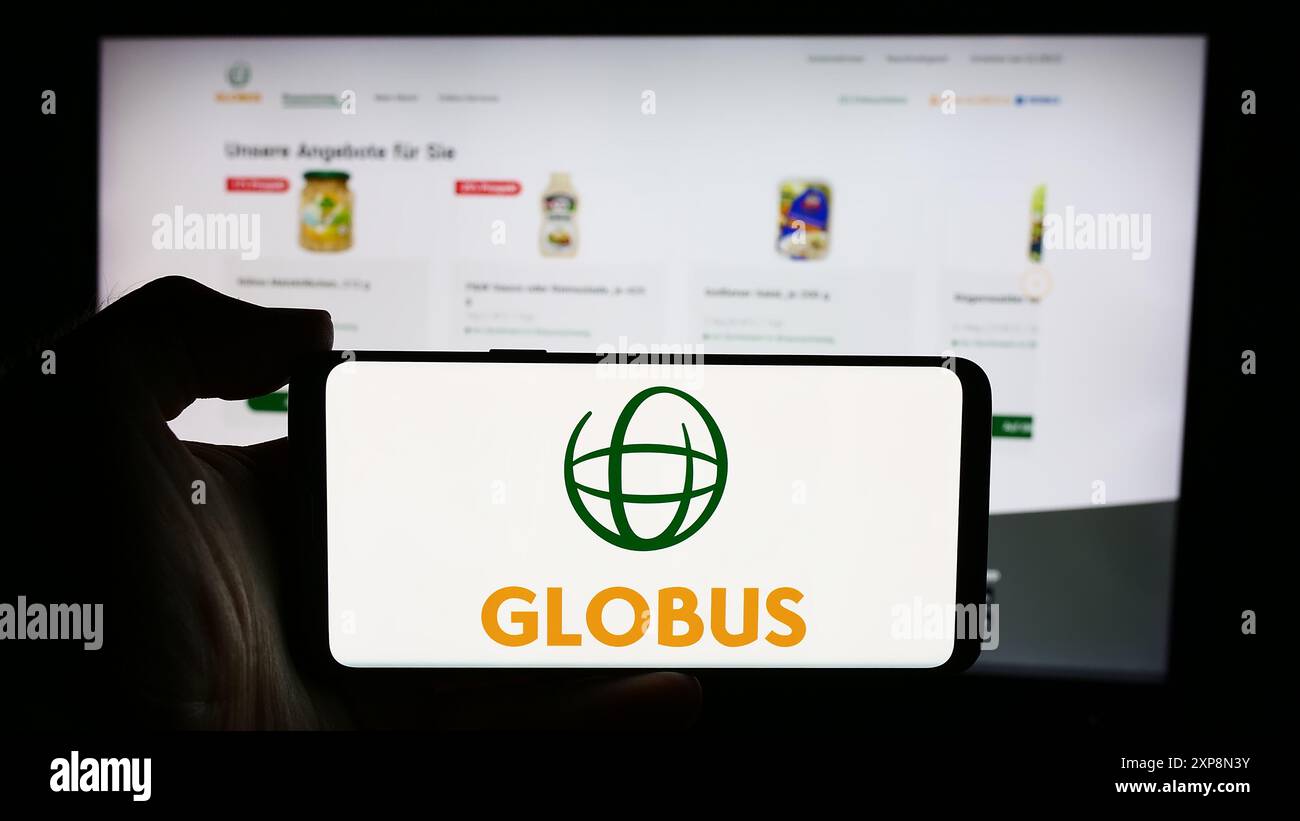 Globus hypermarket holding hi-res stock photography and images - Alamy