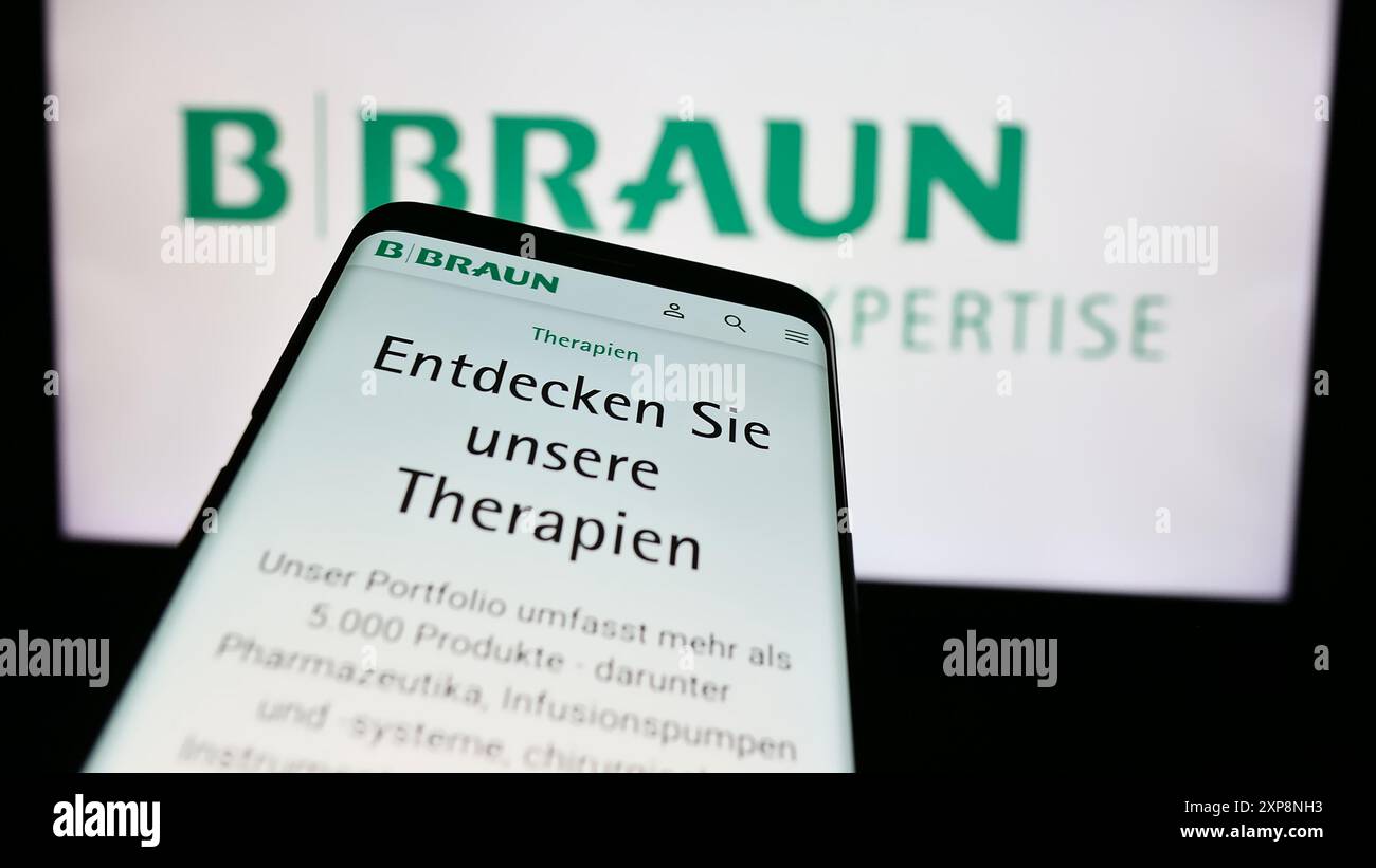 Mobile phone with webpage of Germany pharmaceutical device company B ...