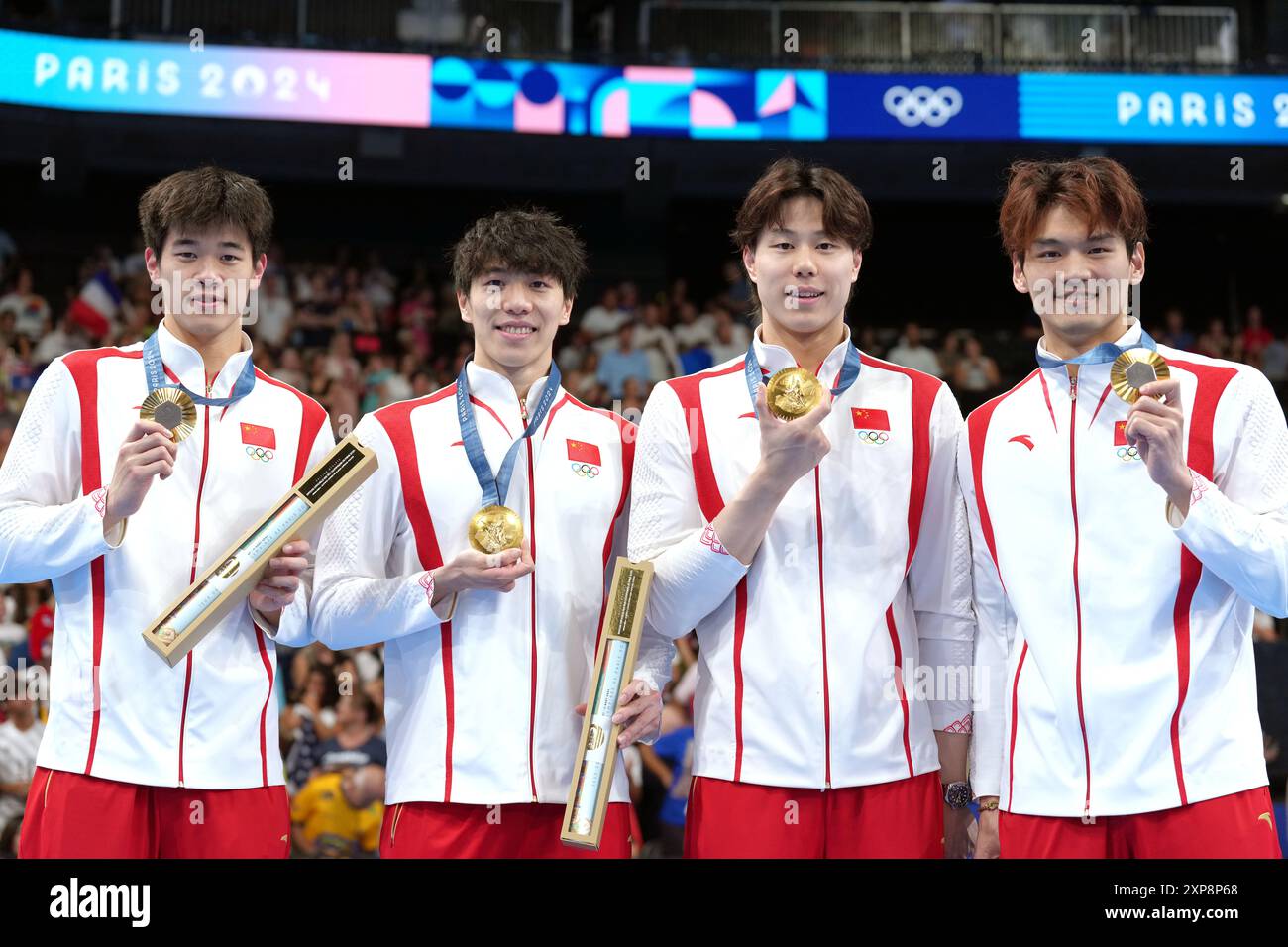 Paris, France. 4th Aug, 2024. Gold medalists Team China attend the victory ceremony for the men ...