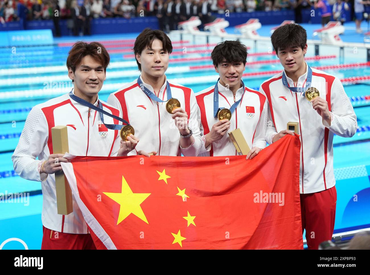 Paris, France. 4th Aug, 2024. Gold medalists Team China attend the victory ceremony for the men ...