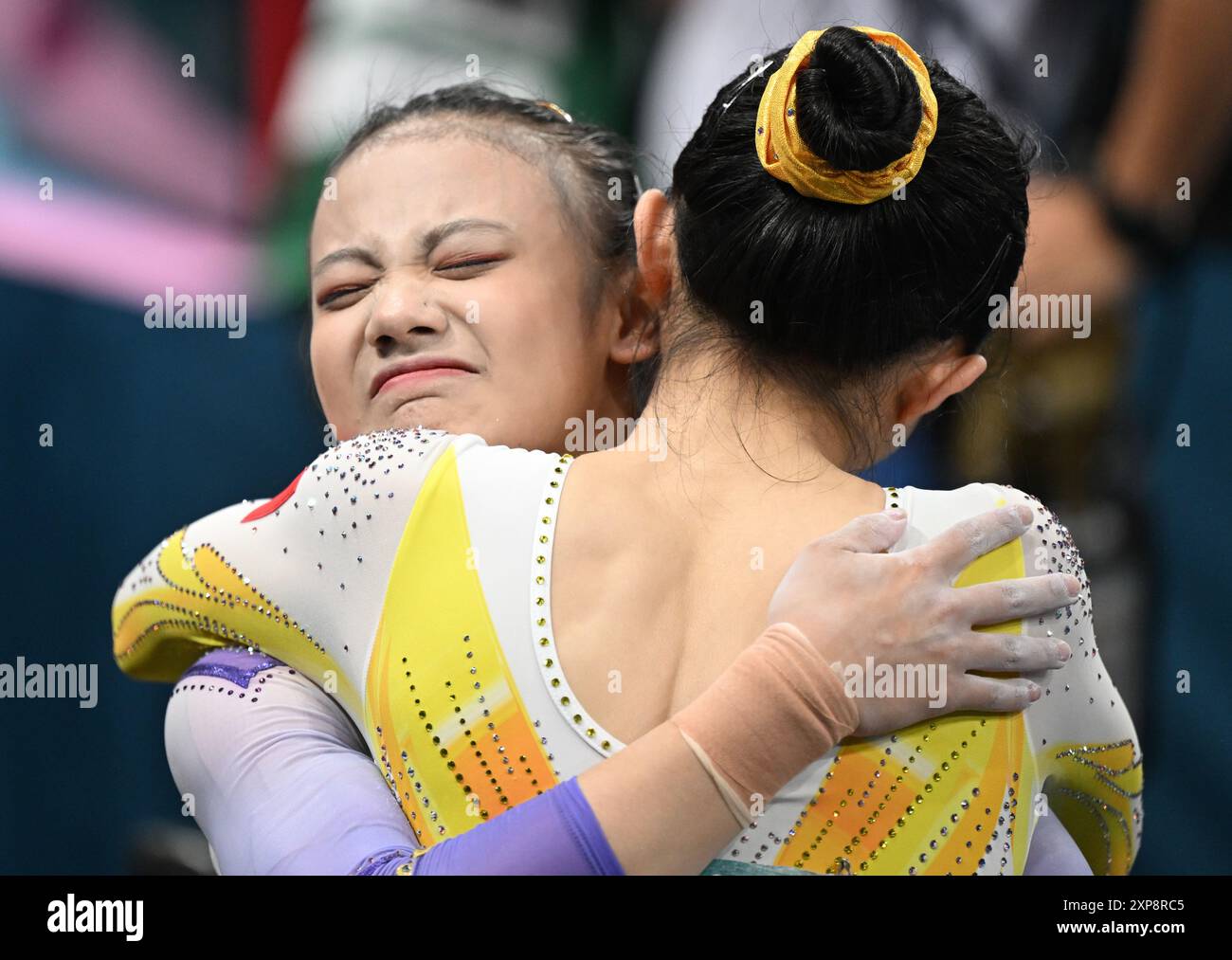 Paris, France. 4th Aug, 2024. Qiu Qiyuan (rear) of China celebrates ...