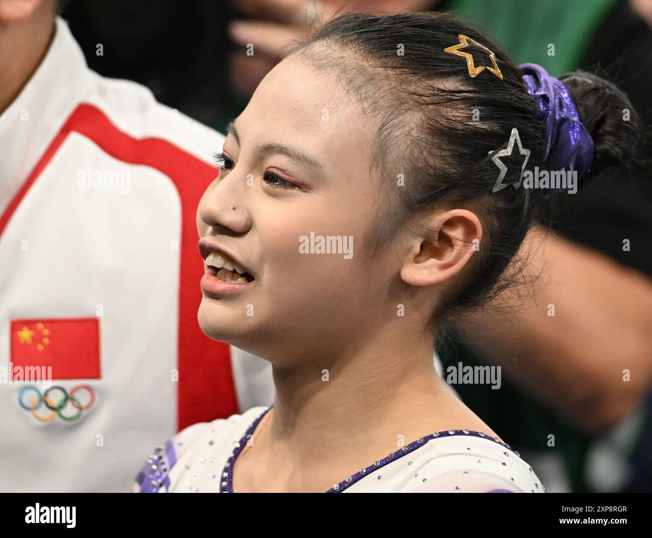Paris, France. 4th Aug, 2024. Qiu Qiyuan of China reacts after the women's uneven bars final of ...