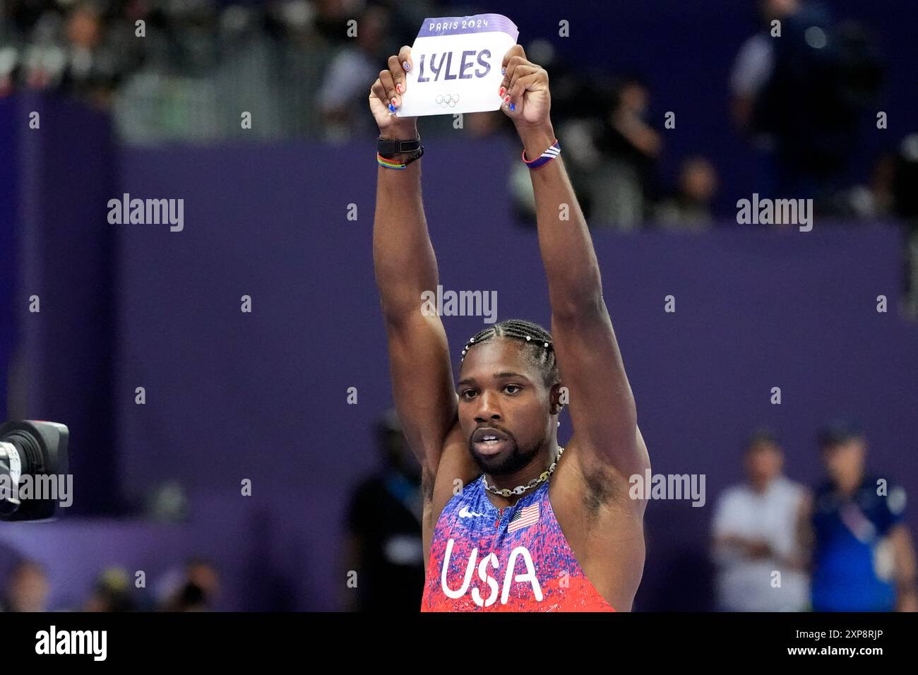 Noah Lyles, of the United States, celebrates after winning the men's ...