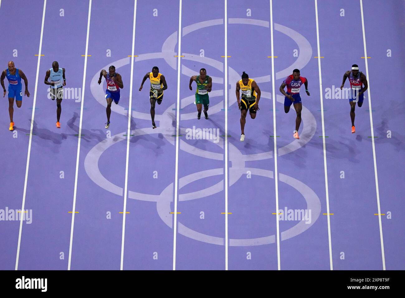 Athletes compete in the men's 100-meter final at the 2024 Summer ...
