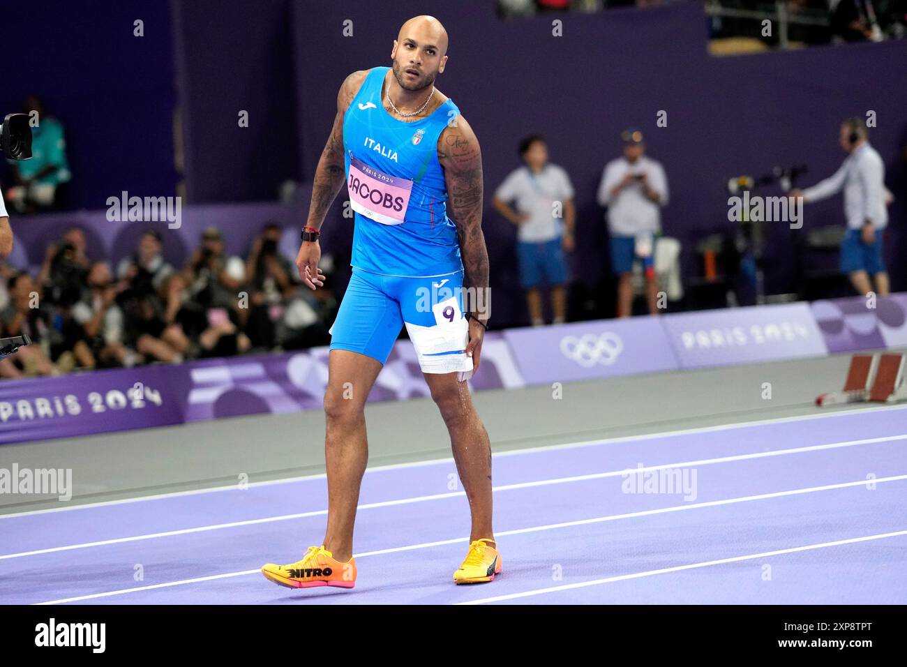 Lamont Marcell Jacobs, of Italy, reacts after the men's 100-meter final ...