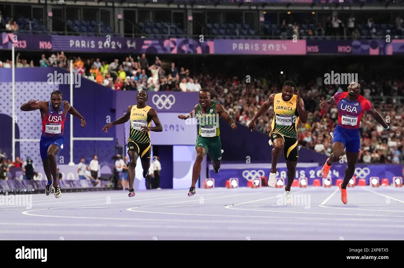 USA's Noah Lyles (left) and Jamaica's Kishane Thompson (right) cross ...