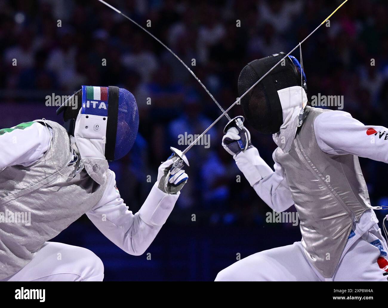 Paris, France. 4th Aug, 2024. Filippo Macchi (L) of Italy competes ...