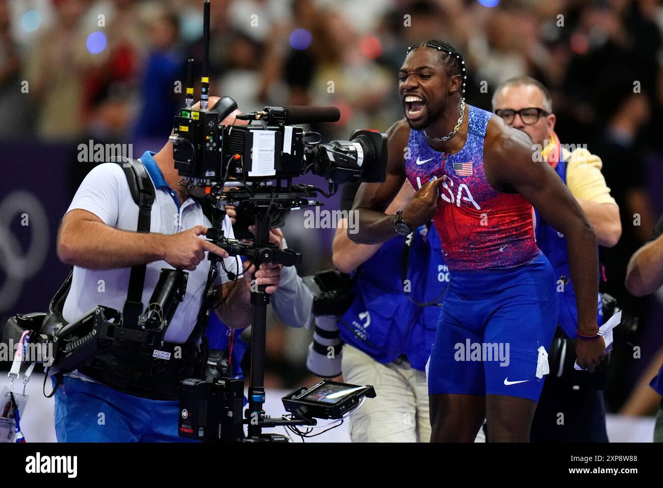 Noah Lyles, of the United States, celebrates after winning the men's ...