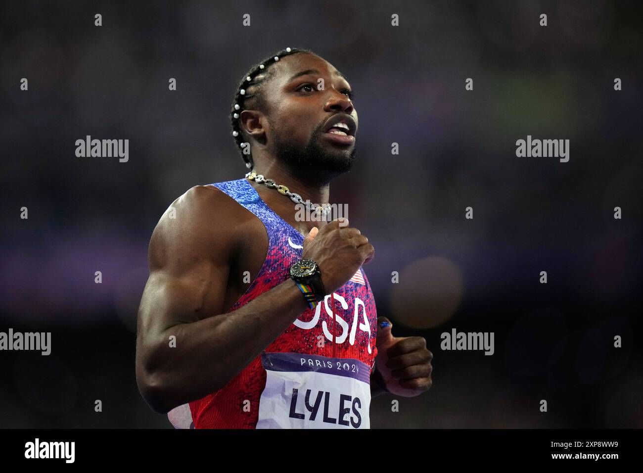 Noah Lyles, of the United States, celebrates after winning the men's ...