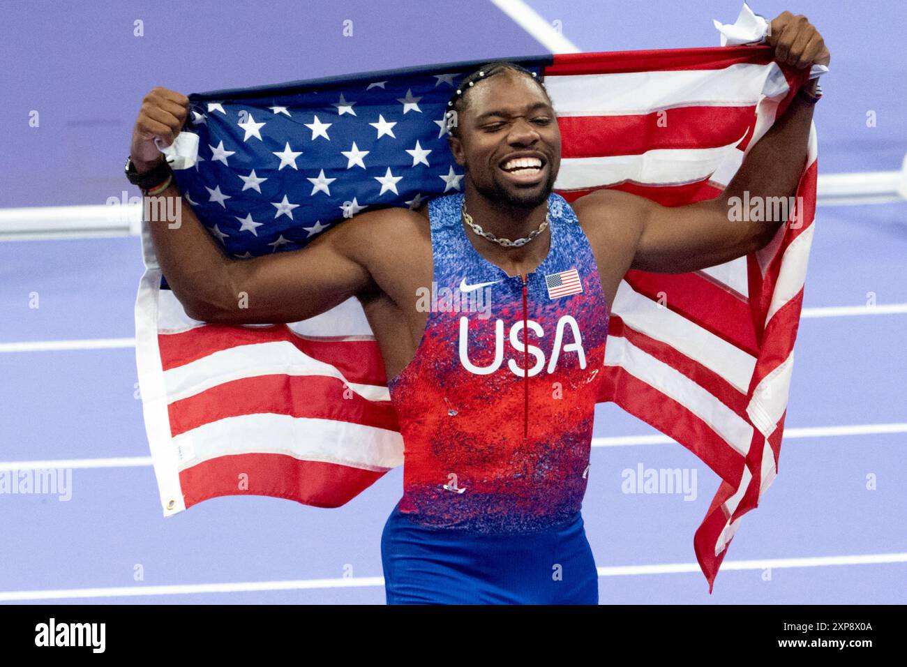 Noah Lyles, of the United States, celebrates after winning the men's ...