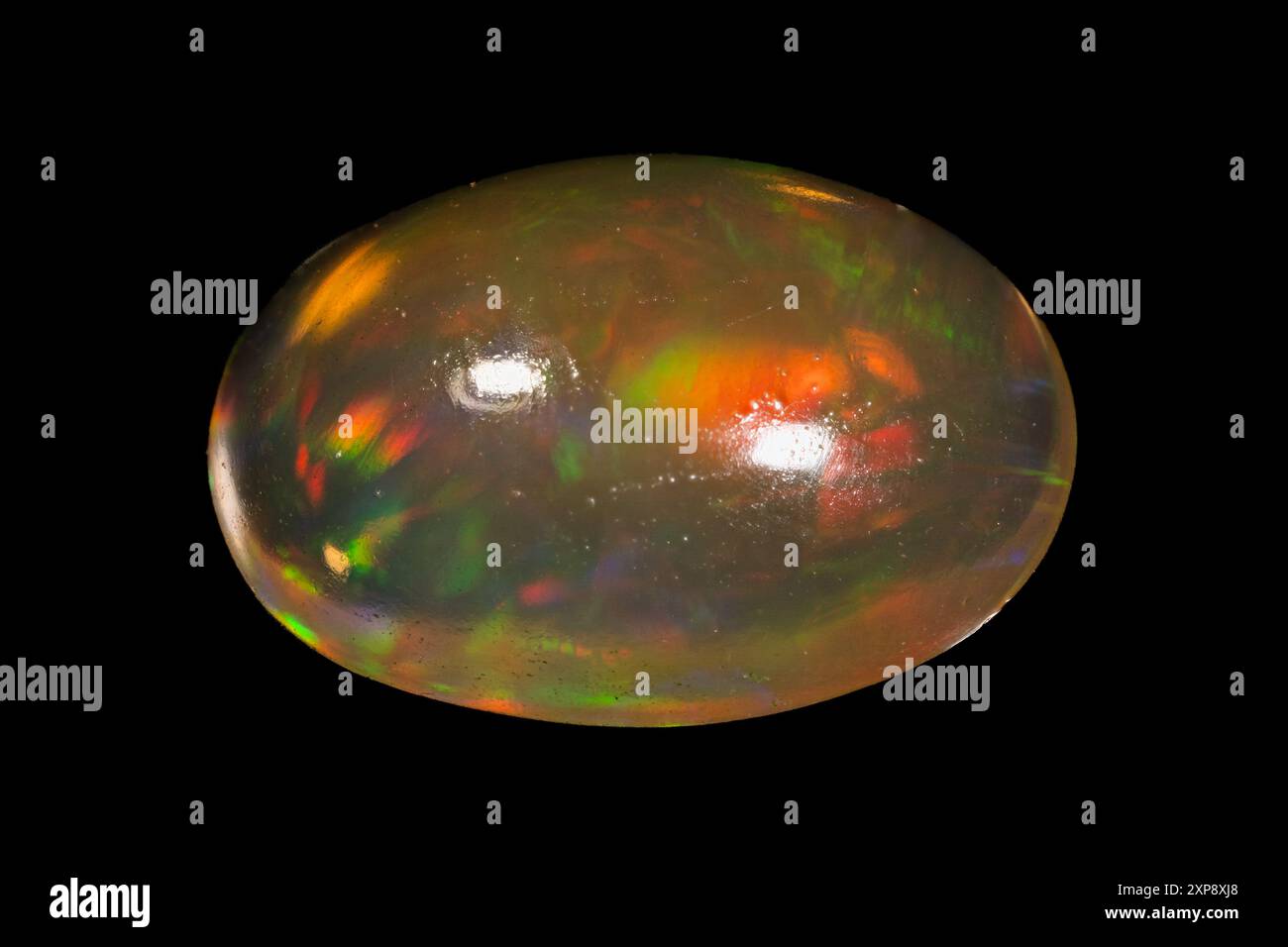 natural rainbow opal gem isolated on the black background Stock Photo ...