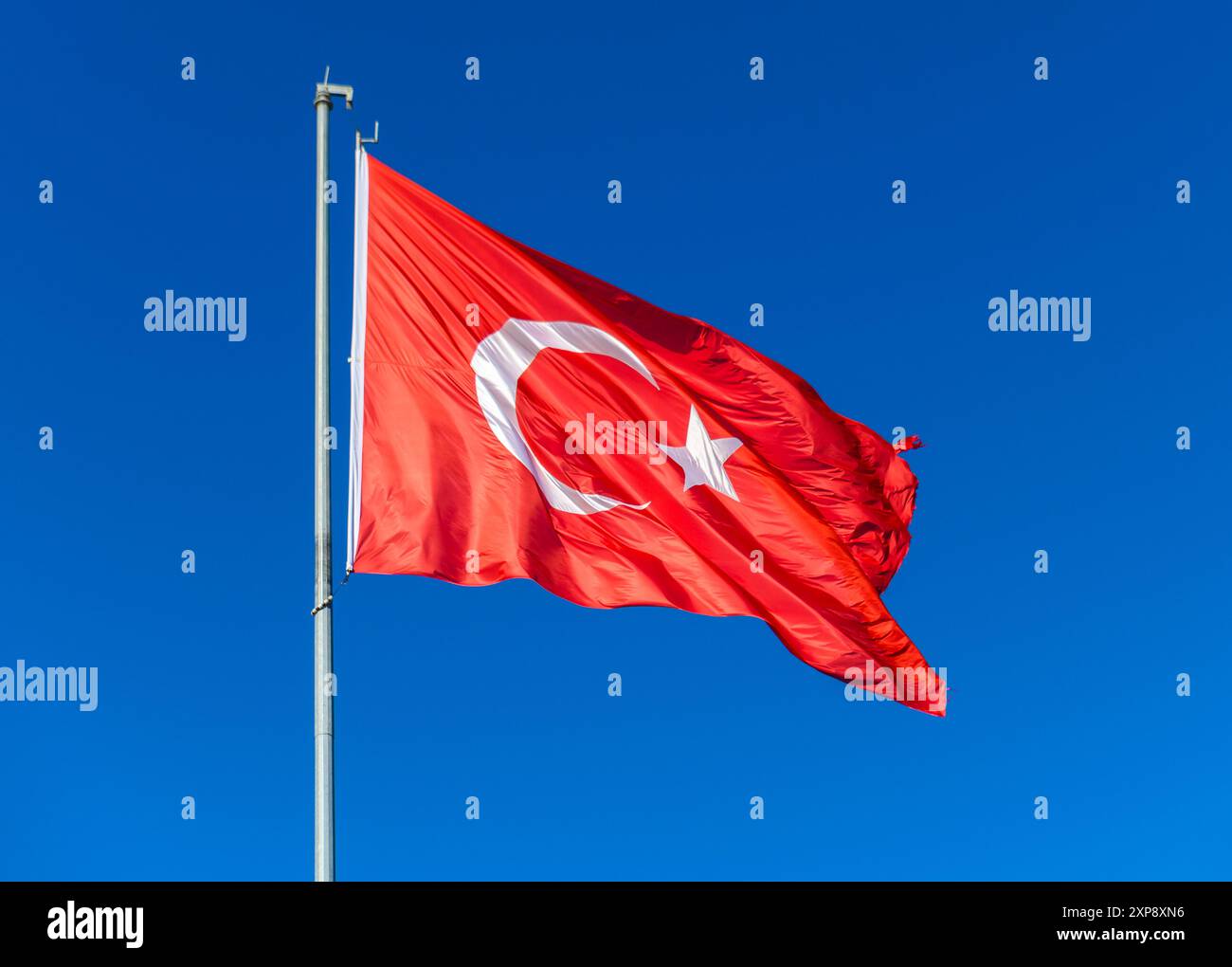 Turkish flag with blue sky background Stock Photo - Alamy