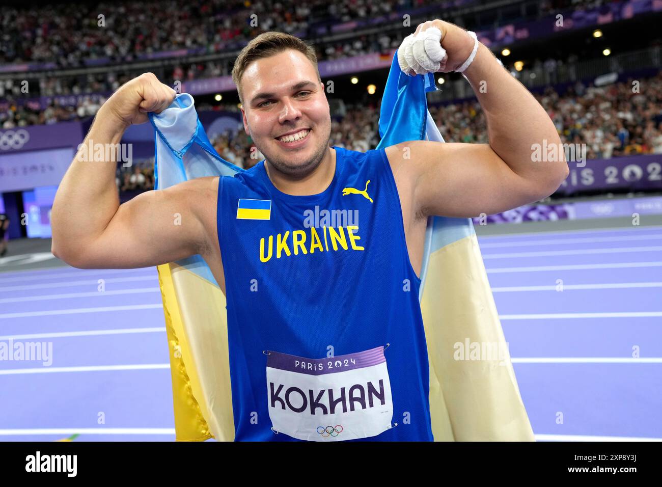 Mykhaylo Kokhan, of Ukraine, reacts after his third place finish in the men's hammer throw final ...