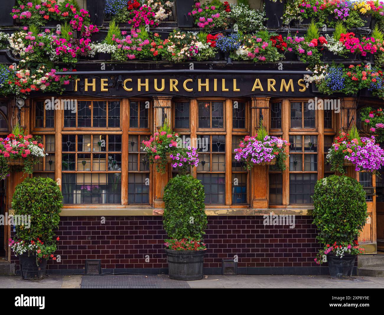 London, United Kingdom - June 25, 2024: Fuller’s Churchill Arms is a ...