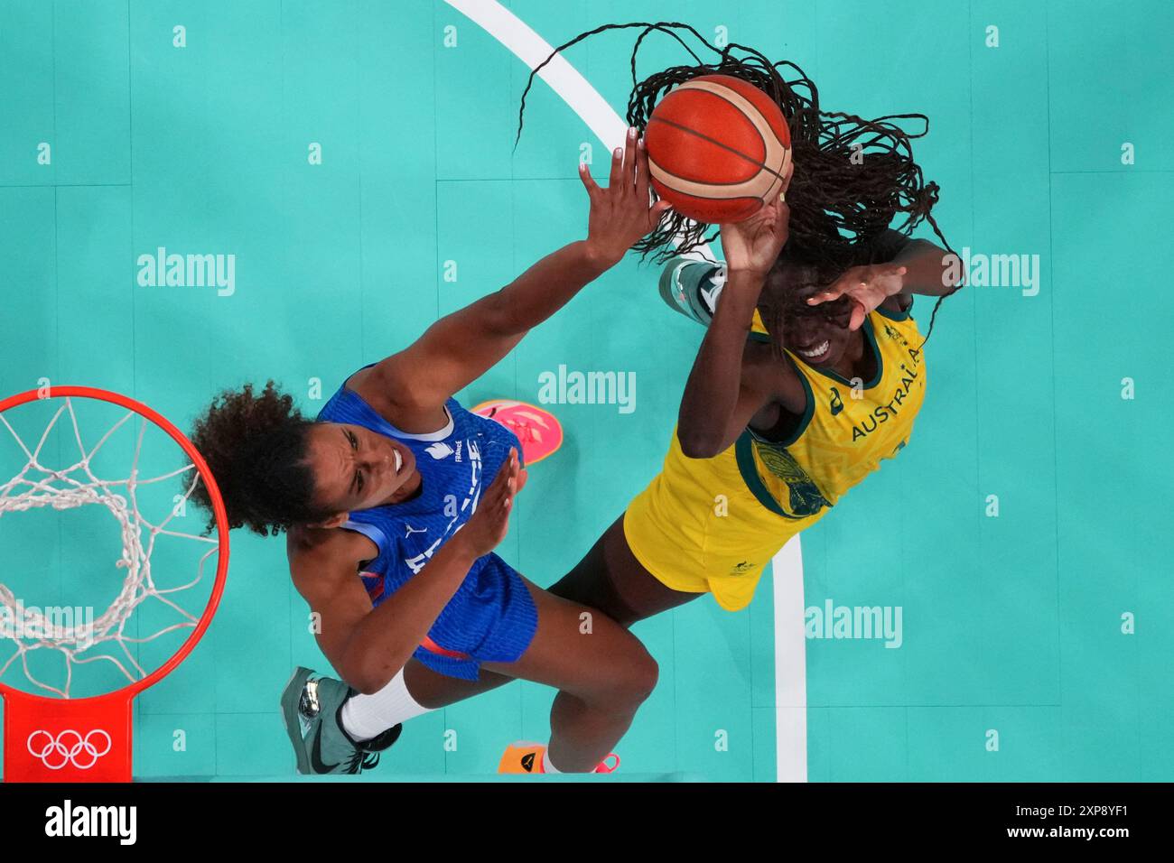 Ezi Magbegor (13), of Australia, shoots over Marieme Badiane (22), of ...