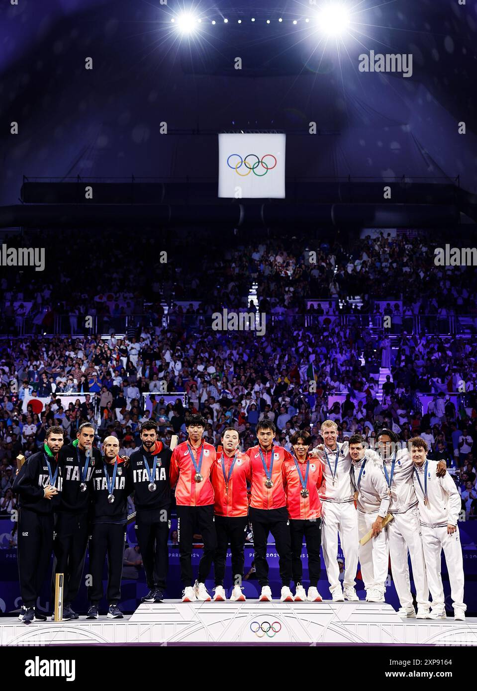 Paris, France. 4th Aug, 2024. Gold medalists team Japan (C), silver medalists team Italy (L) and ...
