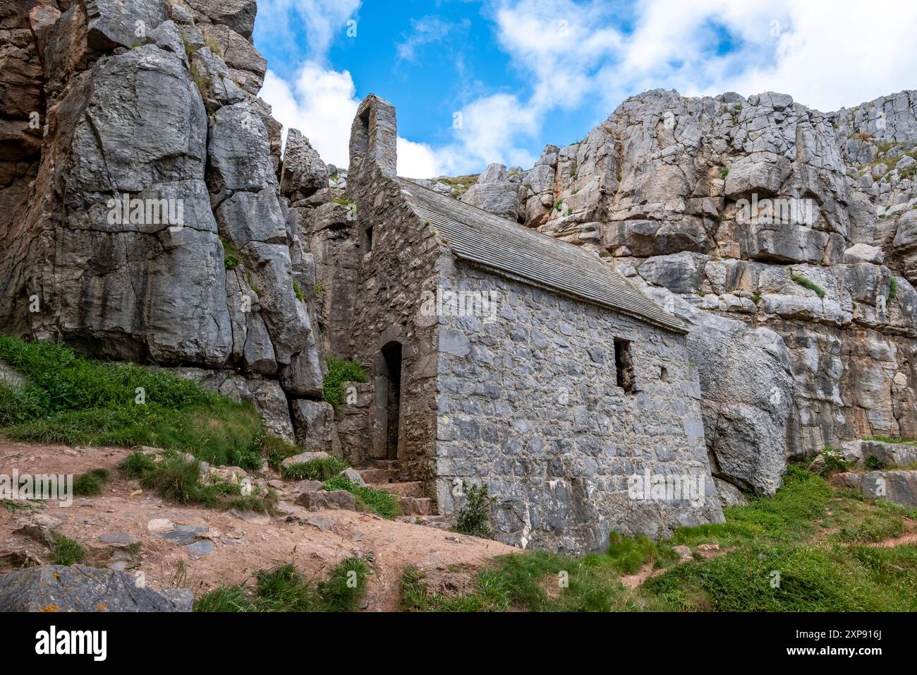 Saint Govan's Chapel tucked away in the cliff at St Govan's Head, in ...