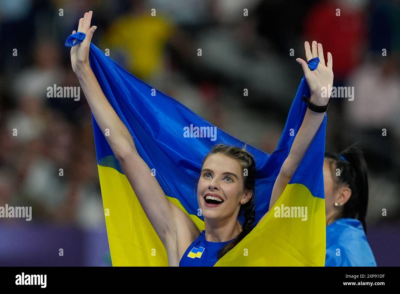 Yaroslava Mahuchikh, of Ukraine, celebrates winning the gold medal in ...