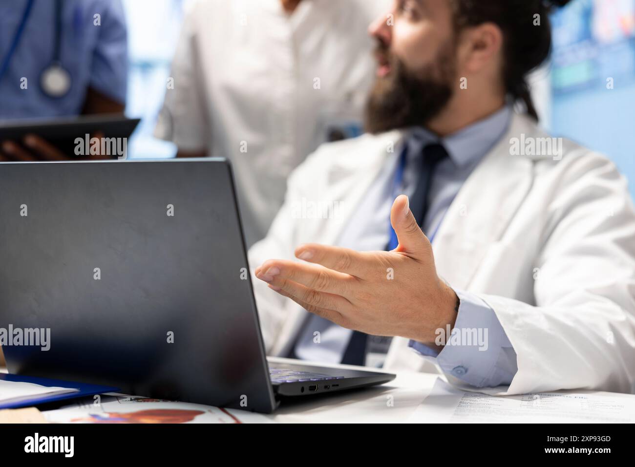 Licensed medic examining test results and healthcare records in cabinet ...