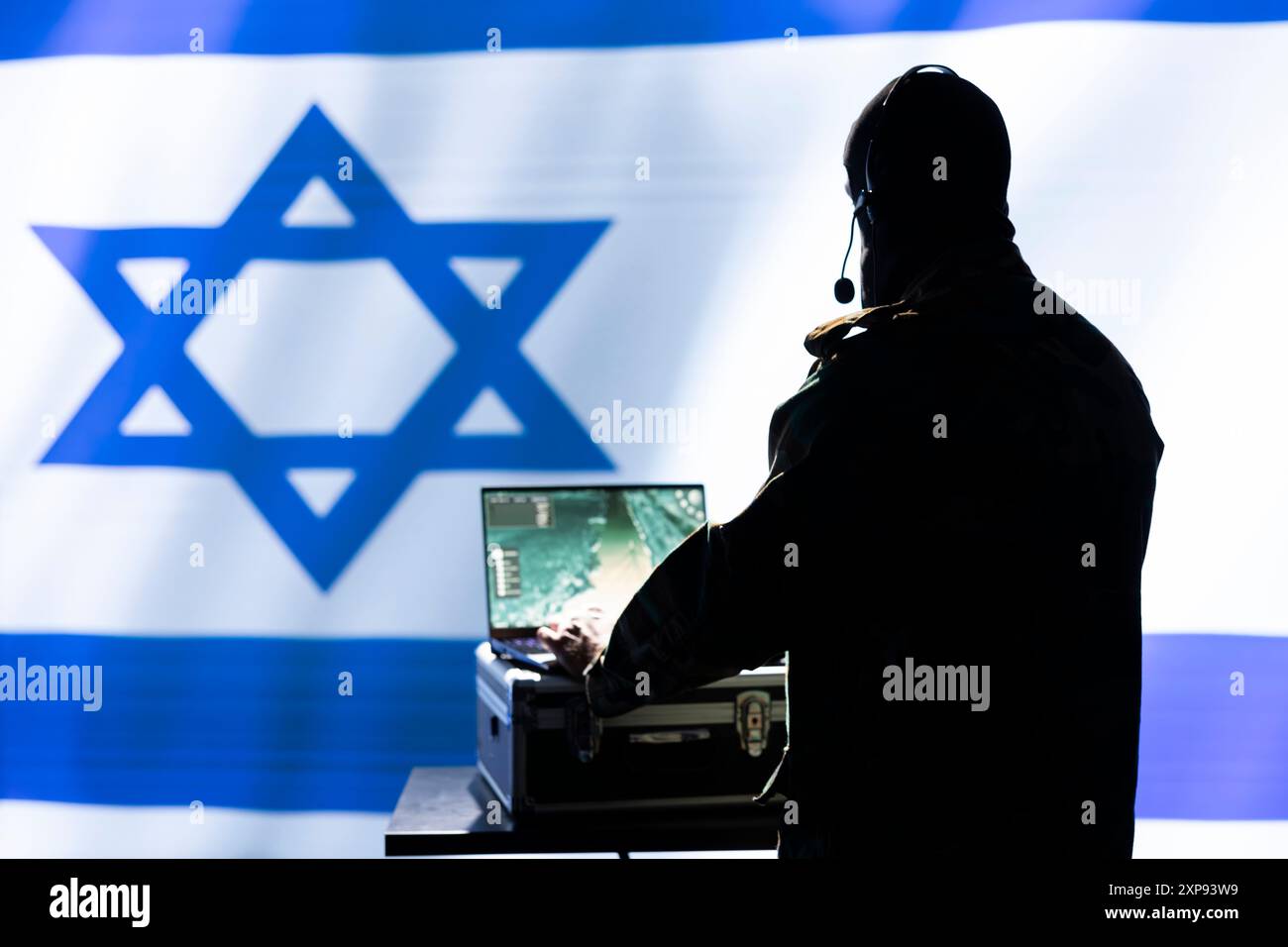 Israel Mossad agent working on laptop, analyzing aerial reconnaissance ...