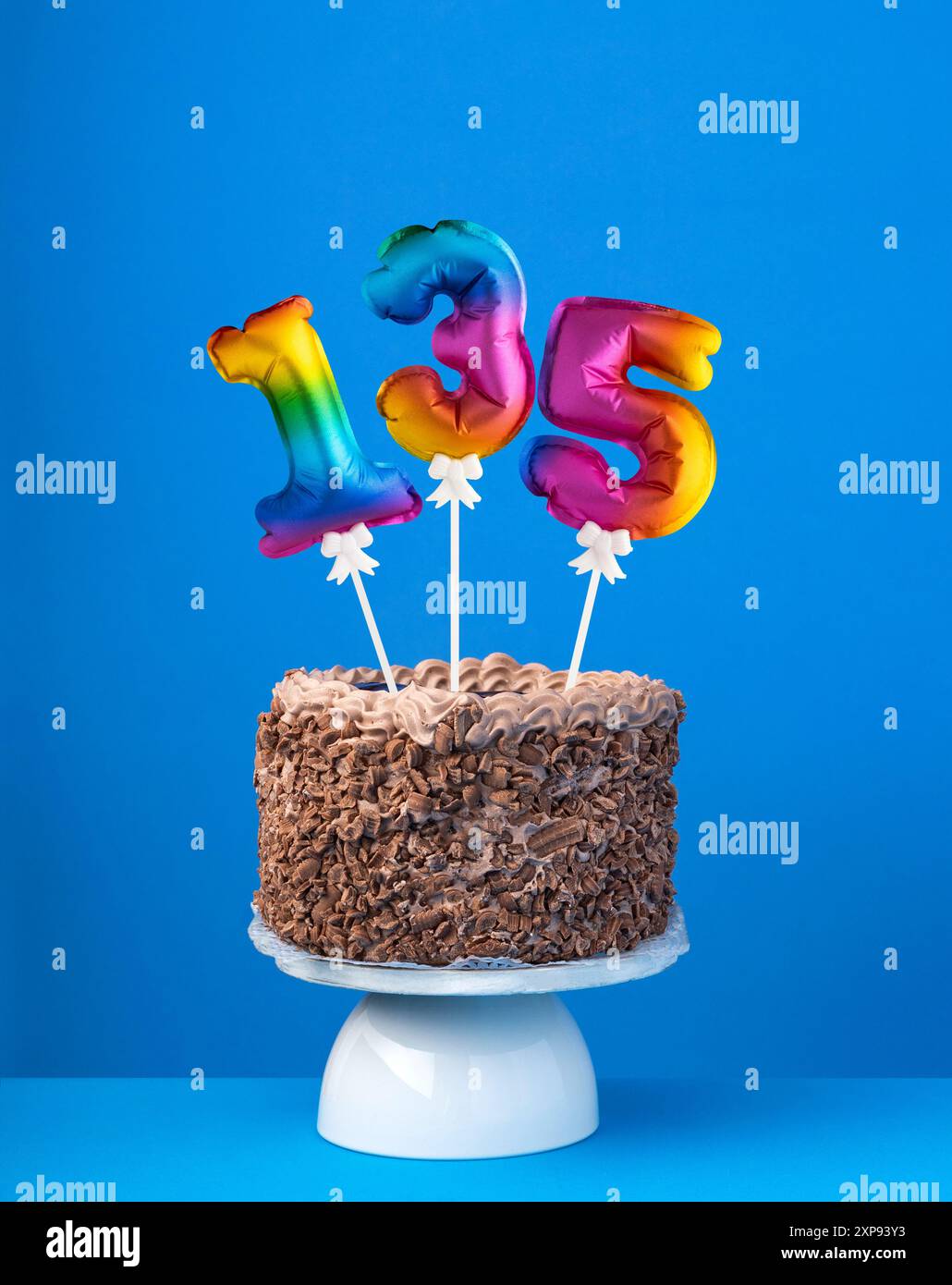 Air balloon number 135 - Birthday cake on blue background Stock Photo ...