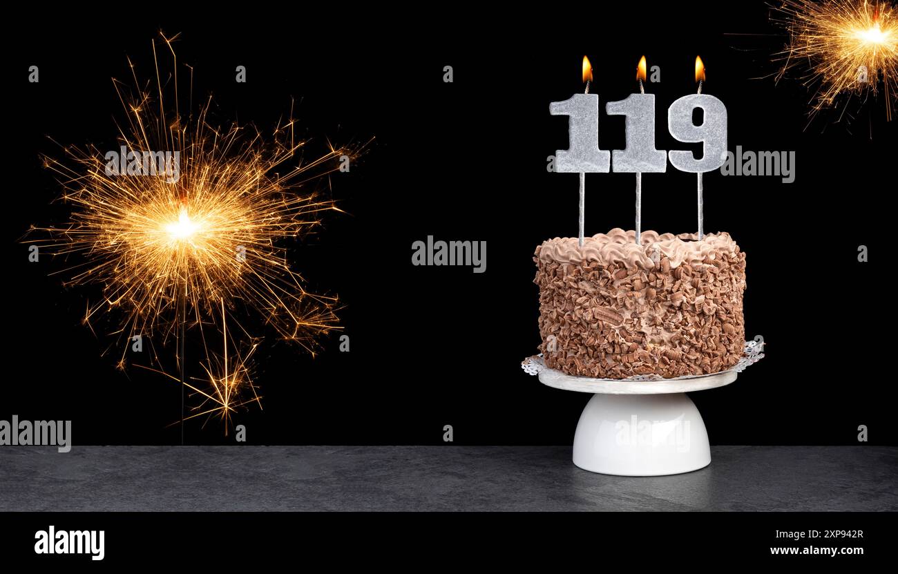 Birthday celebration with cake and candle number 119 Stock Photo - Alamy