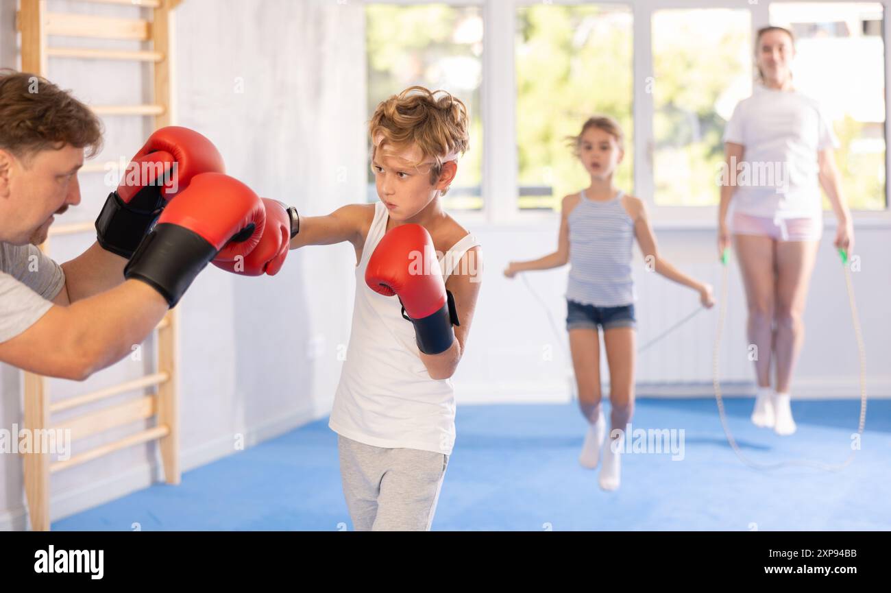 Father and son training boxing in studio Stock Photo - Alamy