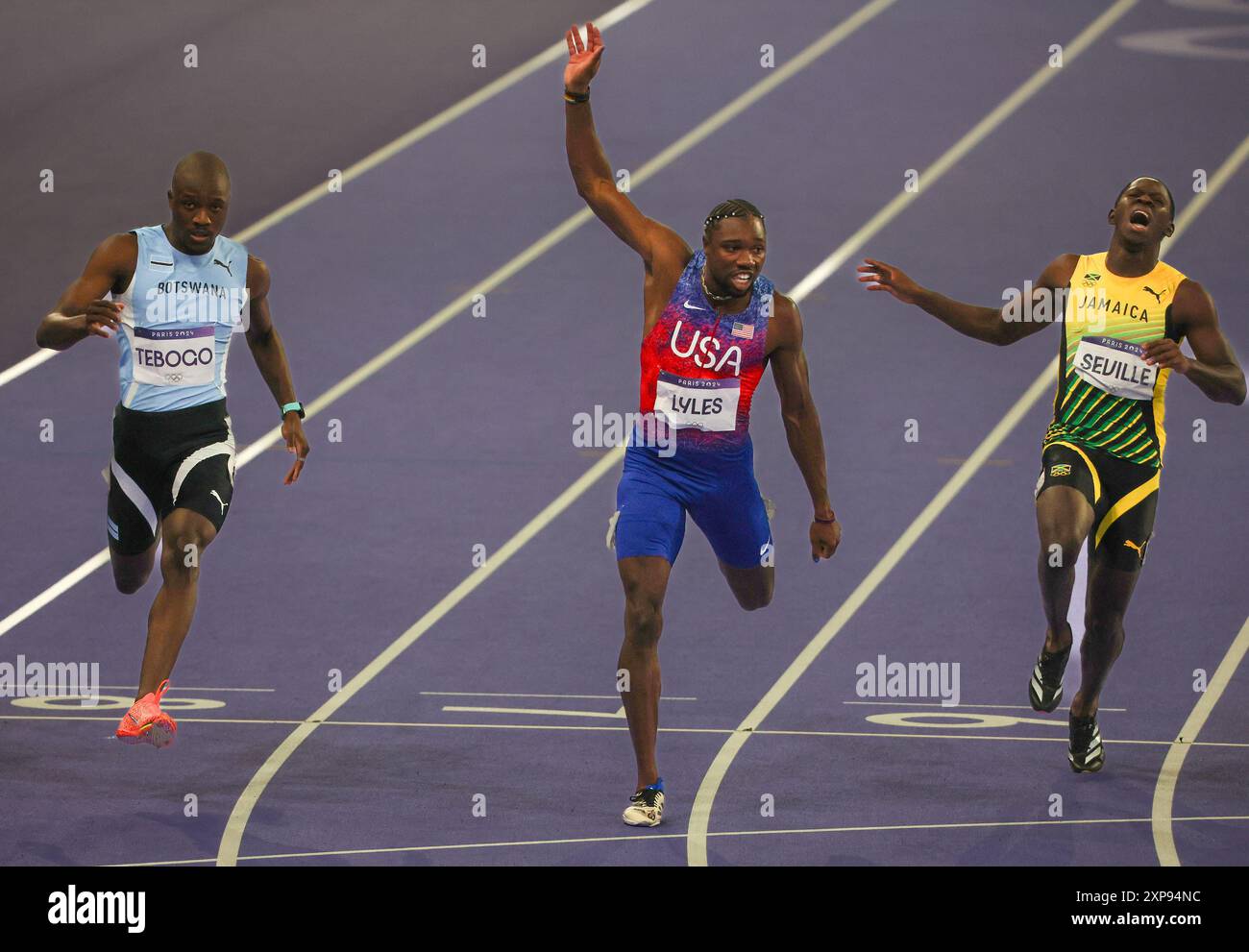 Paris, France. 04th Aug, 2024. Noah Lyles of the USA, center, wins the gold medal during the Men ...